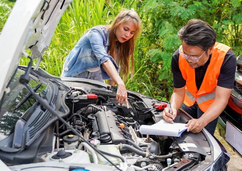 Closeup Auto Mechanic Checking for Breakdowns and List Repairs ...