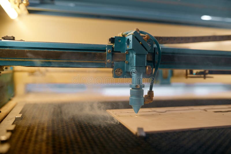 Closeup Automated Cnc Laser Machine Operating With Wooden Plank Stock