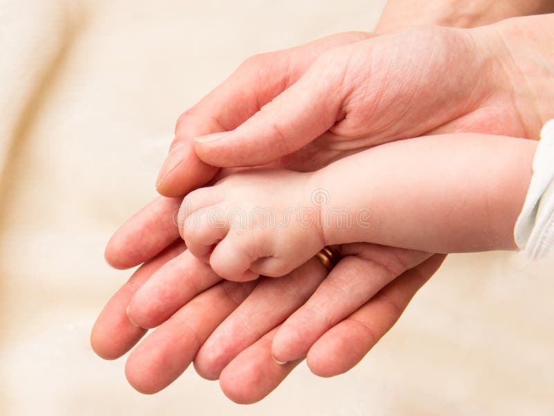 Closeup of Baby Hand into Parents Hands Stock Photo - Image of love ...