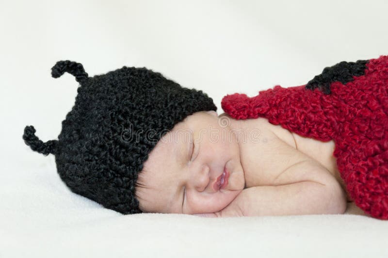 Closeup of Baby with Ladybug Knit Hat and Bodice Stock Photo - Image of ...