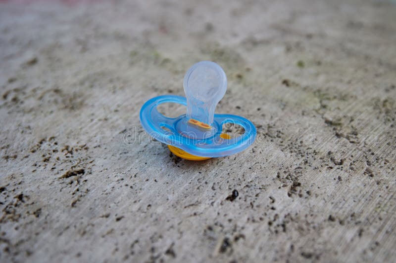 Closeup a Baby Pacifier on a Sidewalk Stock Image - Image of lose ...