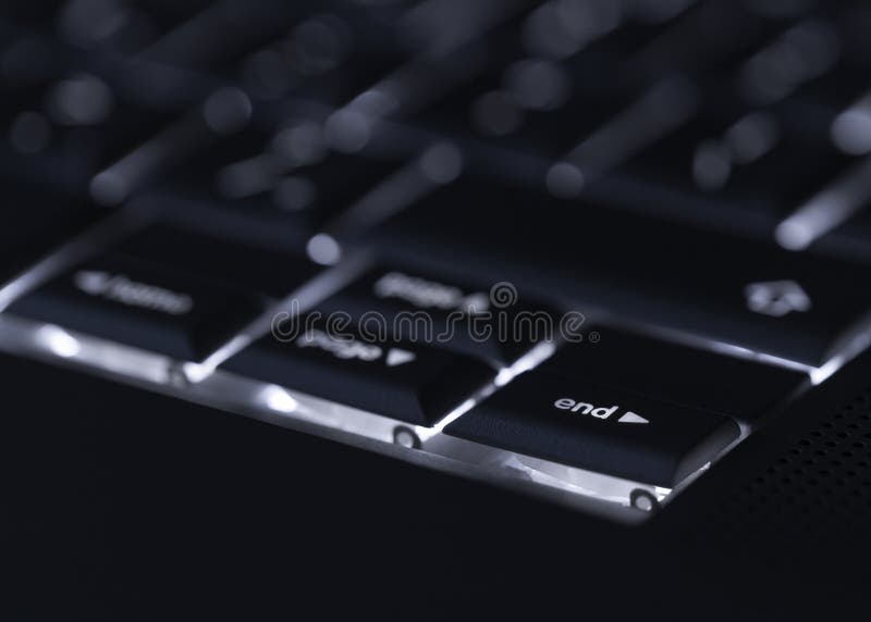 Closeup of Backlit Computer Laptop Keyboard Selective Focus on End Key ...