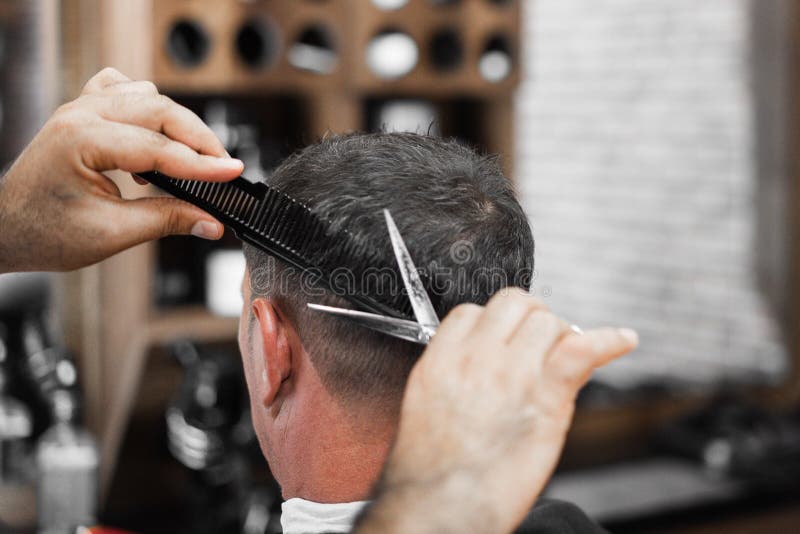 Closeup of a Barber Hands in the Process of Doing a Man S Hairs Stock ...