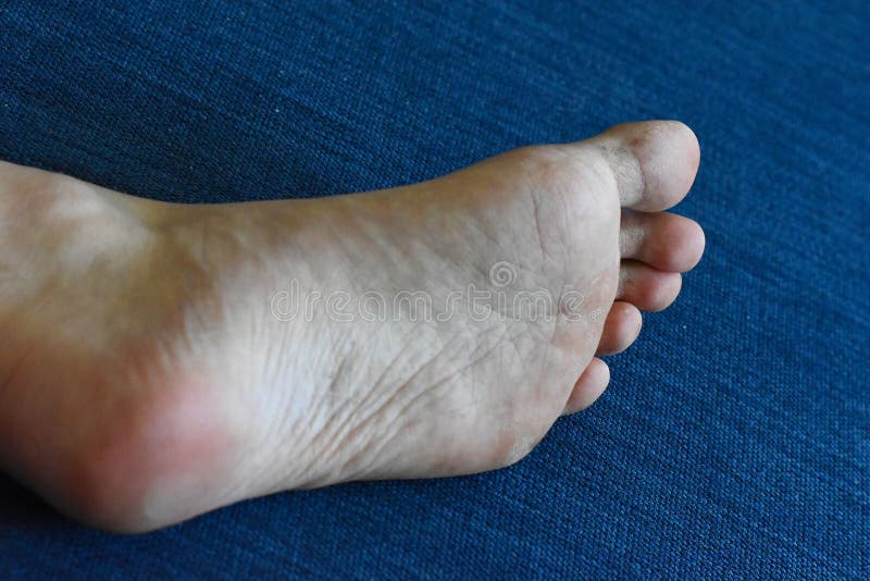 Closeup of a Bare Foot on a Blue Fabric Stock Photo - Image of person ...