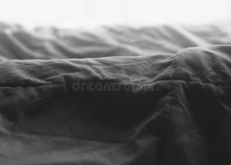 Closeup of Beautiful White Shiny Crumpled Fabric Sheets on the Bed ...