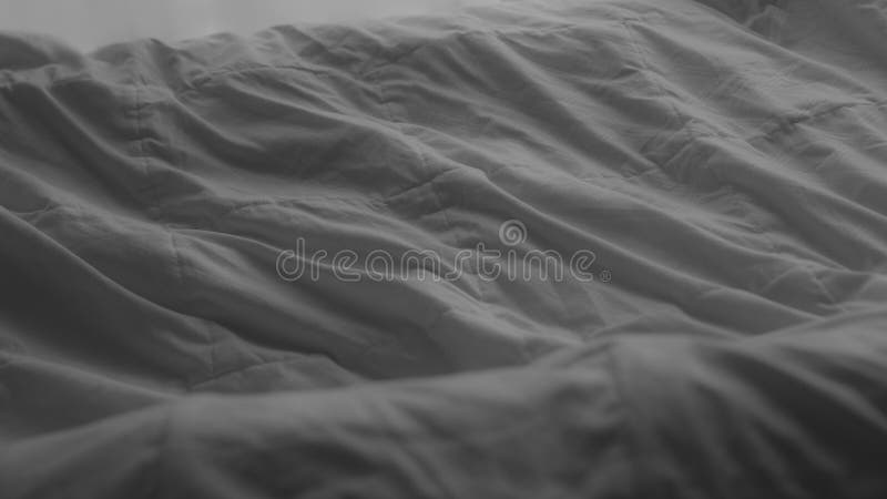 Closeup of Beautiful White Shiny Crumpled Fabric Sheets on the Bed ...