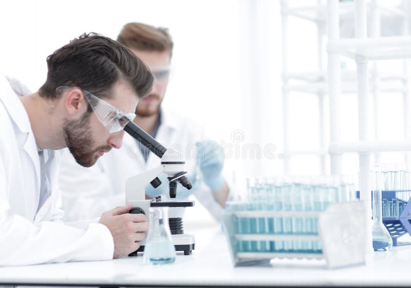 Biologist Explores the Substance Under the Microscope Stock Photo ...