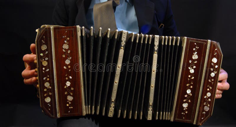 A Closeup of a Black Bandoneon in the Process of Playing Stock Image ...