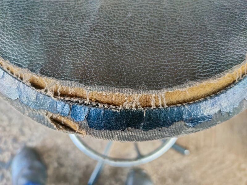 A Black Chair Cover that Has Been Torn Stock Photo - Image of side ...