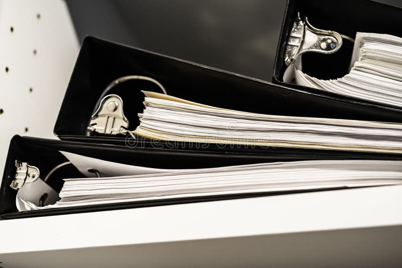 Closeup of Black Folders with Documents on Each Other Stock Photo ...