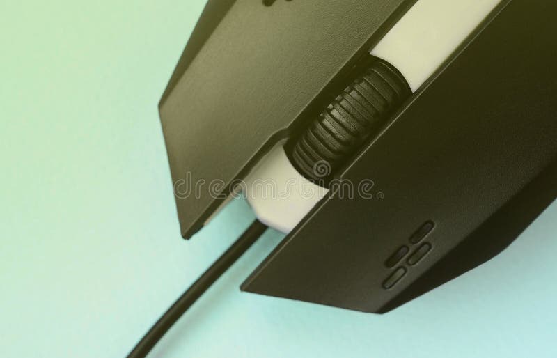 Closeup of a Black Gaming Optical Mouse on a Blue Background Stock ...