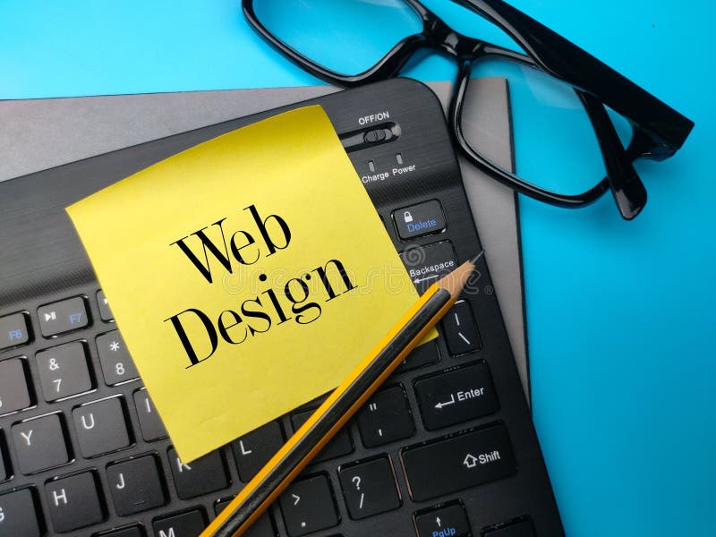 Closeup of a Black Keyboard with a Bright Yellow Sticky Note Displaying ...