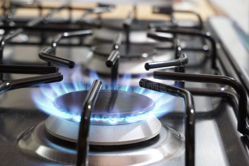 Closeup of a Black Kitchen Burner with Fire on a Stove Stock Image ...