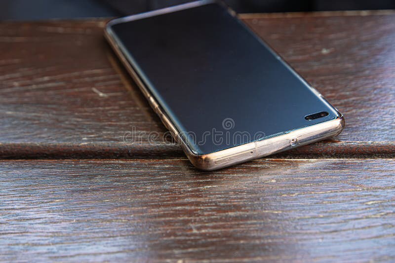 Closeup of the Black Screen Smartphone on a Dark Brown Wooden Cafe ...