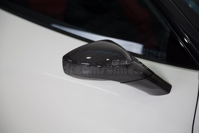 Closeup of a Black Shiny Side-view Mirror of a White Luxury Car Under ...