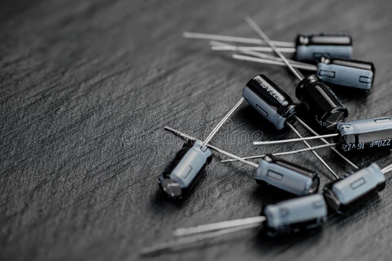 Closeup of Black and Silver Electronic Capacitors Scattered on a Dark ...