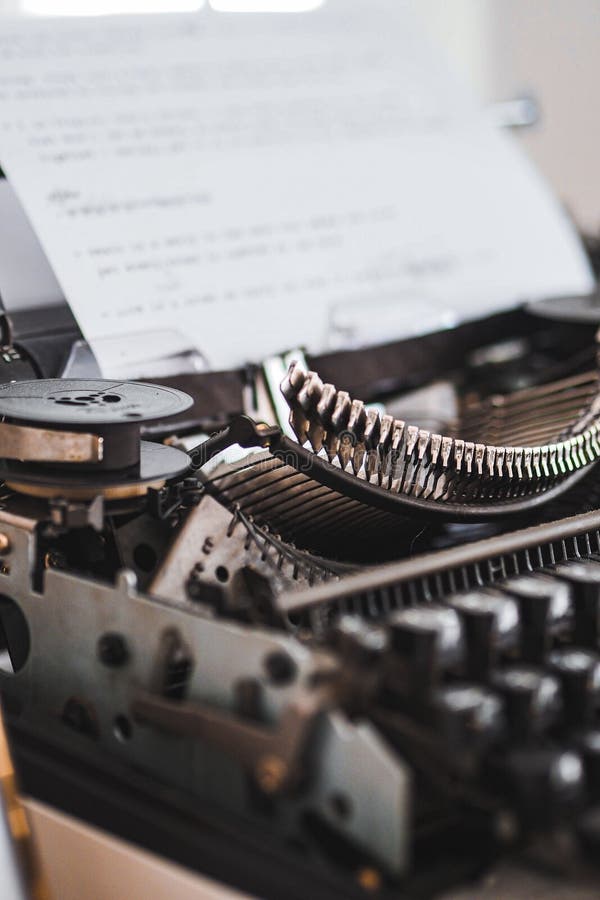 Closeup of a Black Typewriter with a Paper in it. Stock Photo - Image ...