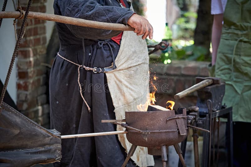 A Closeup of a Blacksmith Fanning a Flame Stock Photo - Image of skill ...