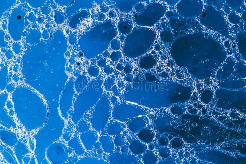 Closeup of Blue Translucent Soap Bubbles Floating on the Water Surface ...