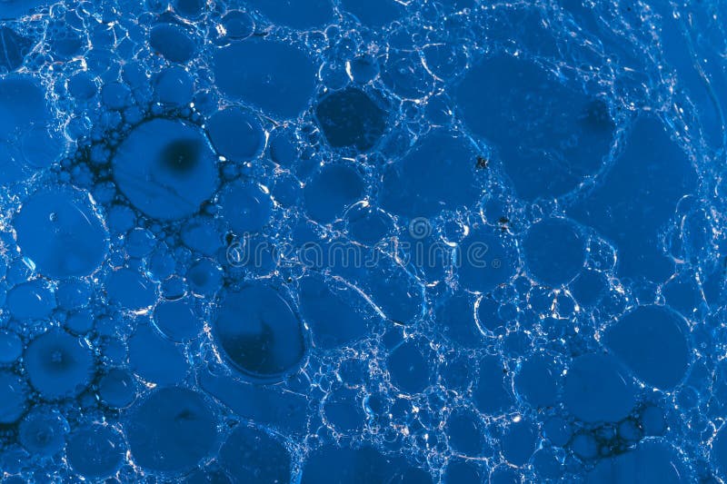 Closeup of Blue Translucent Soap Bubbles Floating on the Water Surface ...