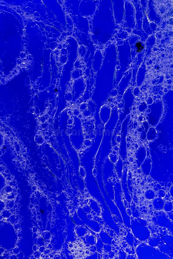 Closeup of Blue Translucent Soap Bubbles Floating on the Water Surface ...