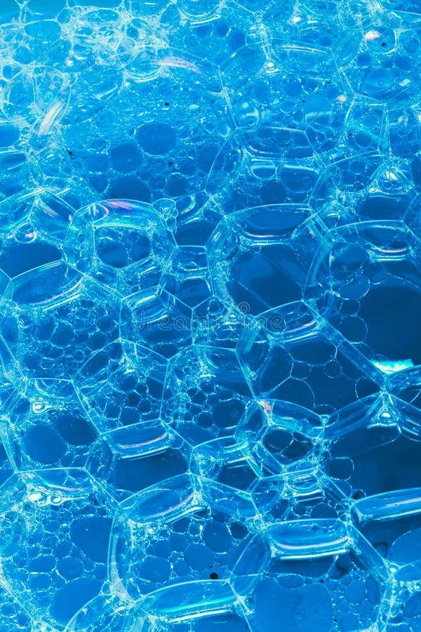 Closeup of Blue Translucent Soap Bubbles Floating on the Water Surface ...