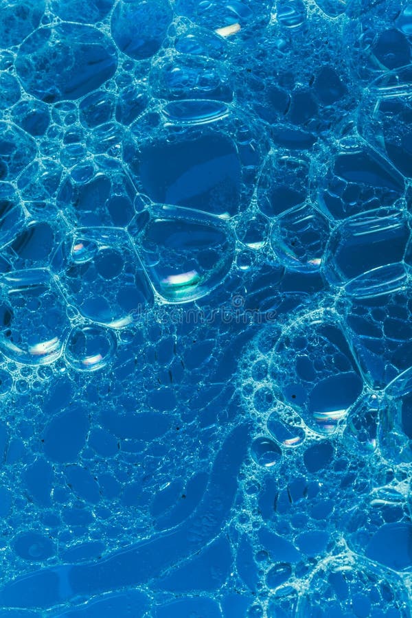 Closeup of Blue Translucent Soap Bubbles Floating on the Water Surface ...