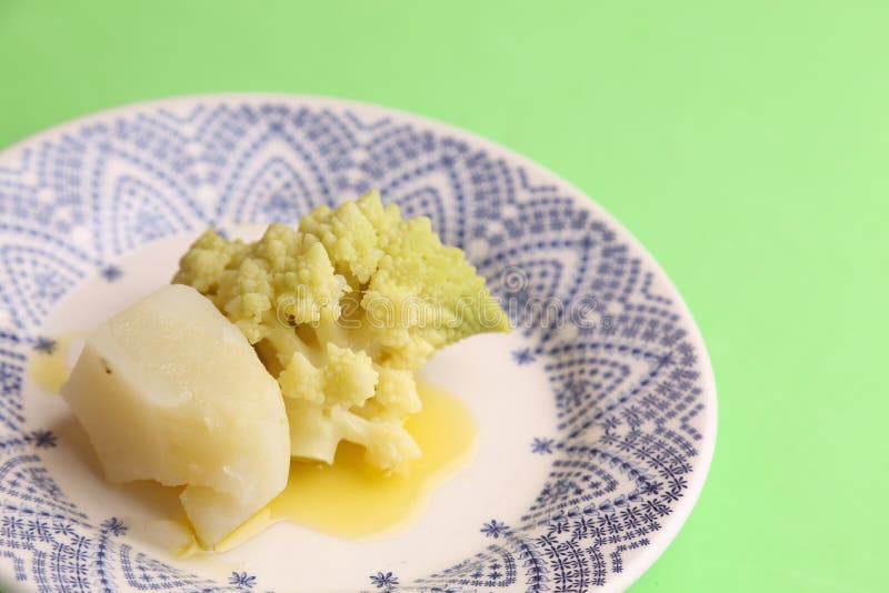 Closeup of Boiled Romanesco Broccoli with Potatoes in a Plate on a ...