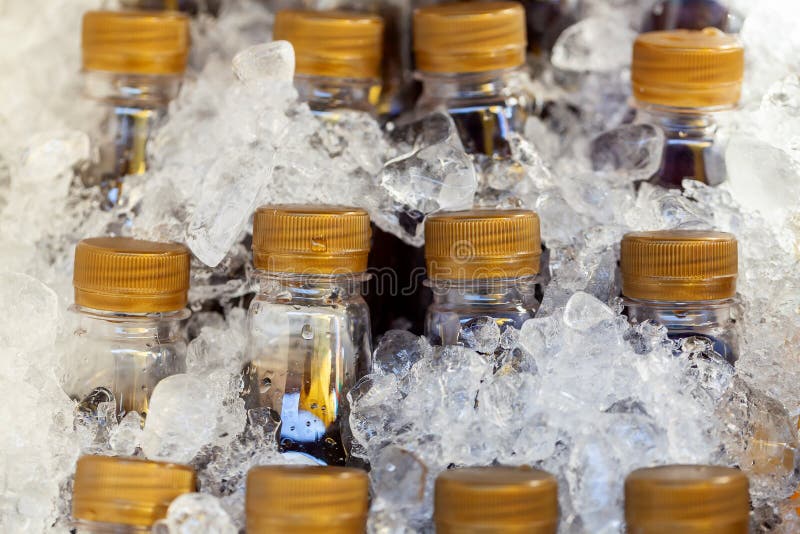 Closeup of Bottles Getting Cool in Ice Cubes.selective Focus. Stock ...