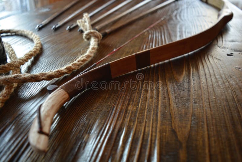 Closeup - bow with arrows stock photo. Image of hunt - 62248720