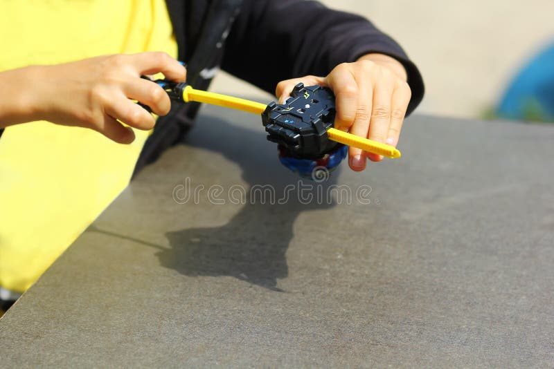 Closeup of Boy`s Hands Playing with a Spinning Top Stock Image - Image ...