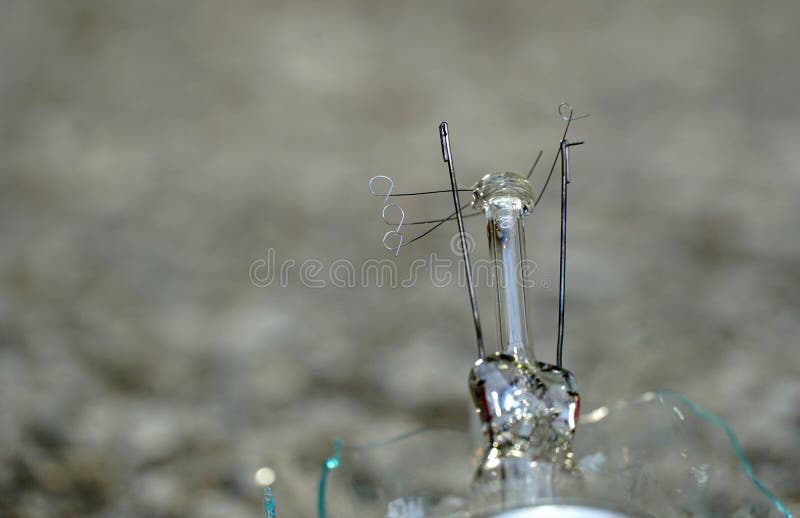 Closeup of a Broken Light Bulb on the Background of Asphalt Stock Image ...