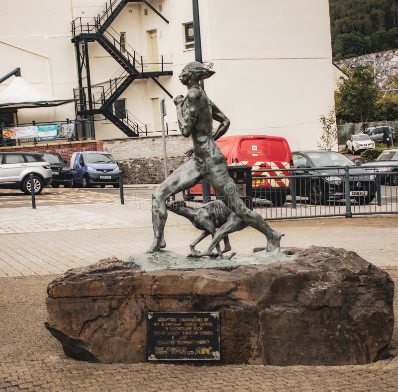 A Statue of a Boy on the Side of the Street Editorial Photography ...