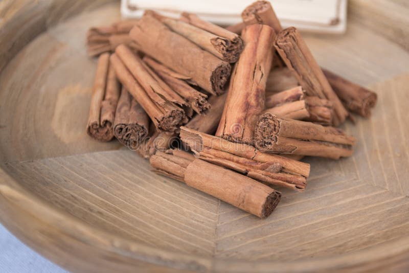 Closeup of Brown Cinnamon Sticks Inside Wooden Round Container Stock ...
