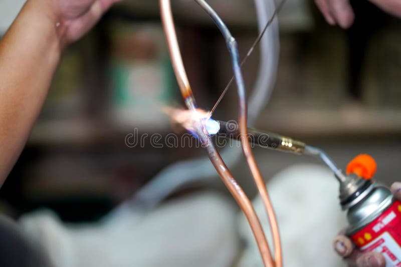 Closeup Builder Using Gas Welding To Connect the Refrigerant Pipe Stock ...