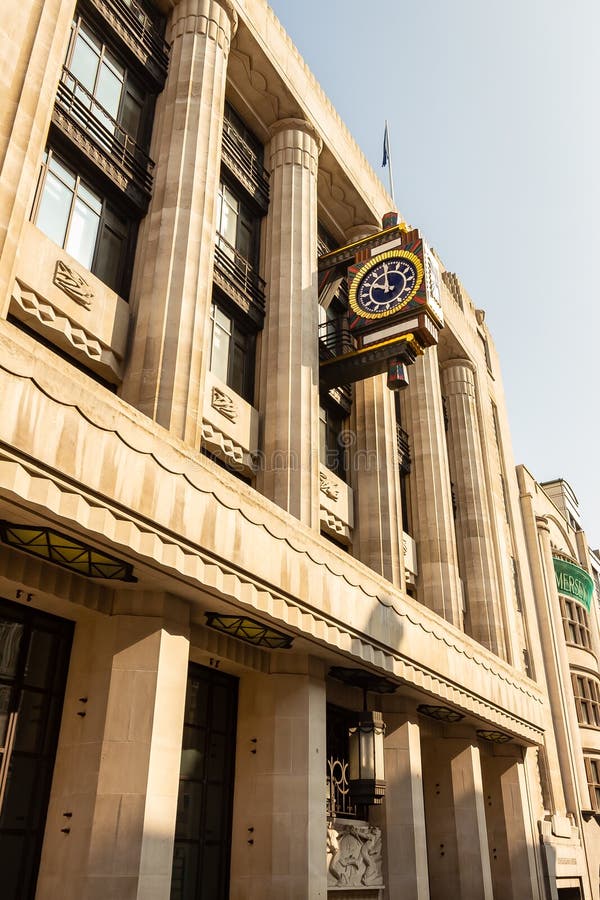 Closeup of a Building in London with a Clock Hanging on the Wall Stock ...