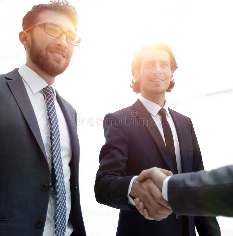 Business Group Welcomes Partner with a Handshake Stock Image - Image of ...