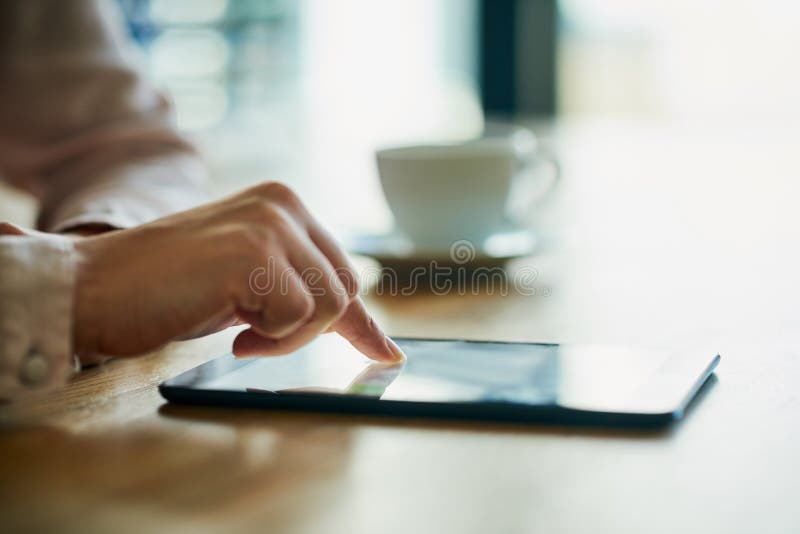 Closeup of Business Hands Working on a Digital Tablet in a Modern ...