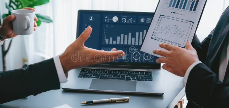 Closeup Busy Analyst Team with Coffee Discuss Financial Data on Laptop ...