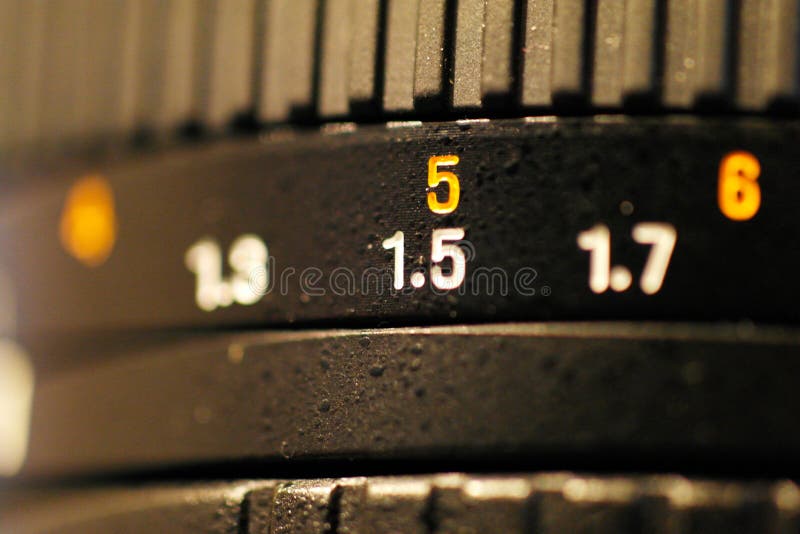 Closeup of a Camera Lens with Numbers on the Black Body Stock Photo ...