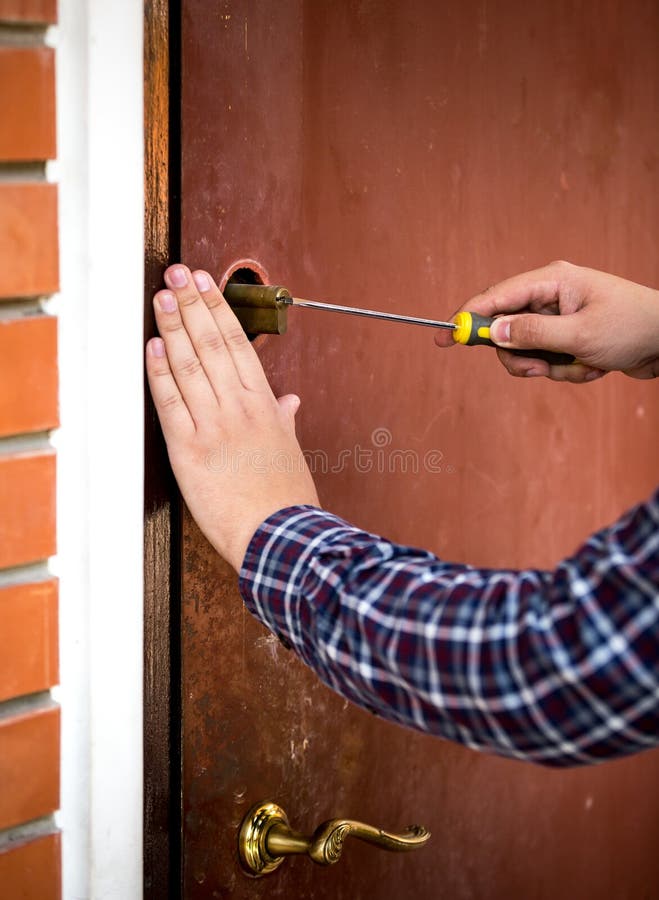 Closeup of Carpenter Fixing Door Lock with Screwdriver Stock Photo ...