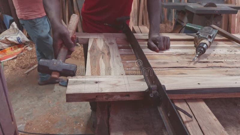 Closeup of a Carpenter Hands Working on Wooden Planks with Tools on a ...