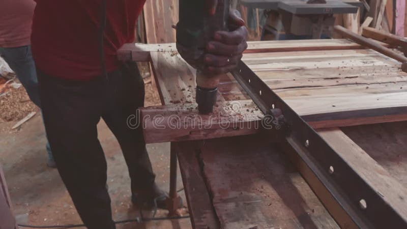 Closeup of a Carpenter Hands Working on Wooden Planks with Tools on a ...