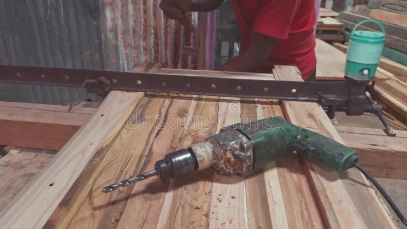 Closeup of a Carpenter Hands Working on Wooden Planks with Tools on a ...