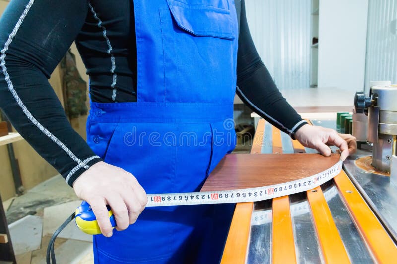 Closeup of Carpenter`s Hands Using One Meter in a Cottage Workshop ...