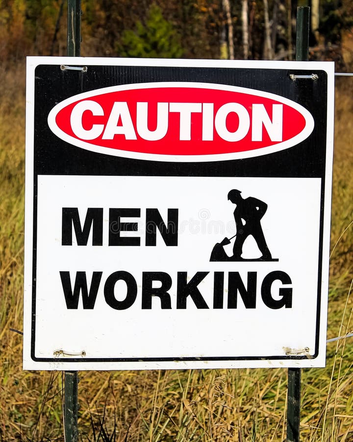 Closeup of a Caution Men Working Sign Stock Photo - Image of industrial ...