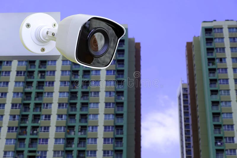 CCTV Camera of Security at Blurred Building Tower with Blue Sky Stock ...