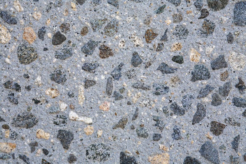 Granite Rocks in the Cement Wall Stock Photo - Image of black, rocks ...