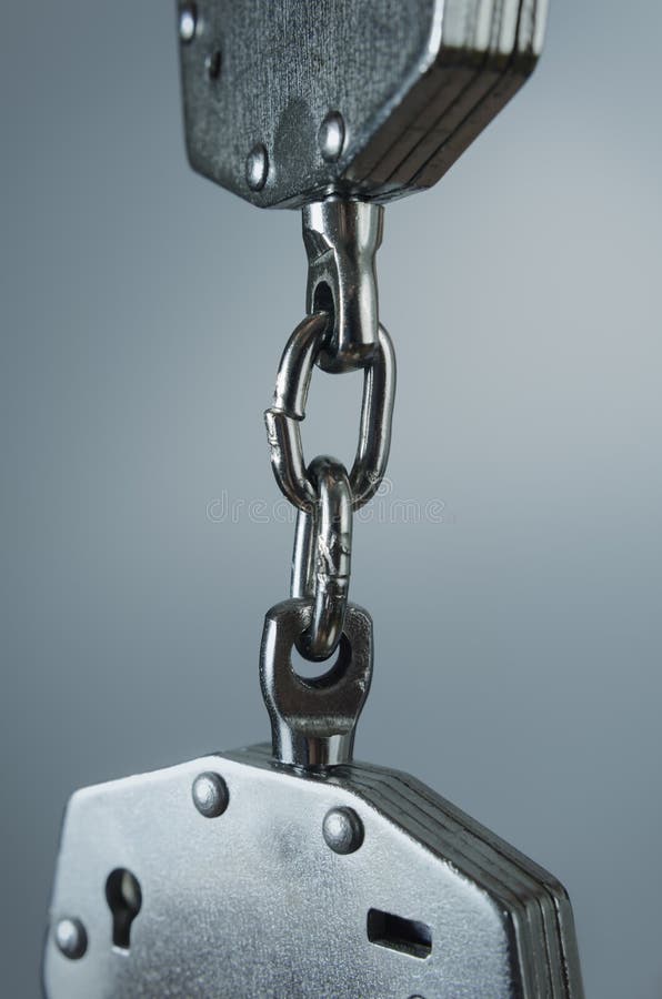 Closeup of Chain of Handcuffs Stock Image - Image of blue, guilt: 166104225