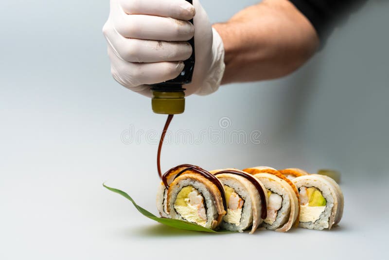 Closeup of Chef Hands Preparing Japanese Food. Japanese Chef Making ... Closeup of Chef Hands Preparing Japanese Food. Japanese Chef Making ...